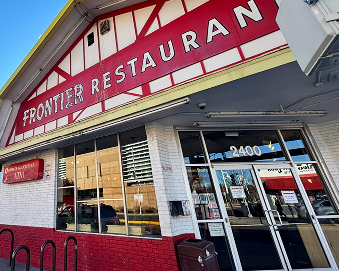 The iconic red and white facade of Frontier Restaurant glows like a beacon for hungry souls wandering Central Avenue after dark.