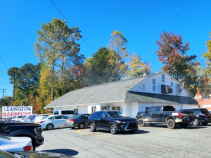 The neon-trimmed roofline glows like a barbecue beacon in the night, guiding hungry pilgrims to this temple of smoke and flavor.