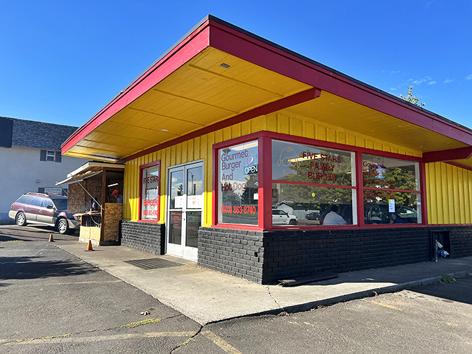 That sunshine-yellow exterior isn't just a building&mdash;it's a beacon of burger hope standing proudly against the Oregon sky, promising delicious things inside.