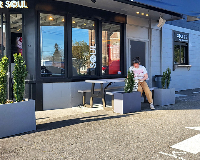 The sleek black exterior of Burger Seoul stands as a beacon of burger brilliance in Tacoma, promising culinary adventures that await inside.