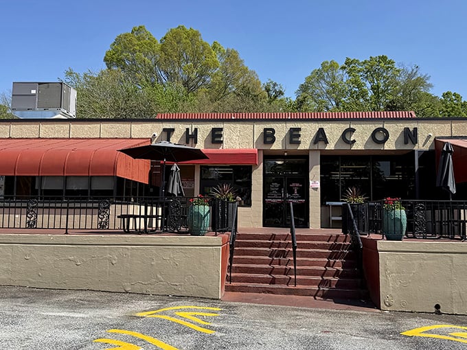 The Beacon's iconic fa&ccedil;ade stands proudly in Spartanburg, its red awnings and stone steps beckoning hungry travelers like a culinary lighthouse on the South Carolina shore.