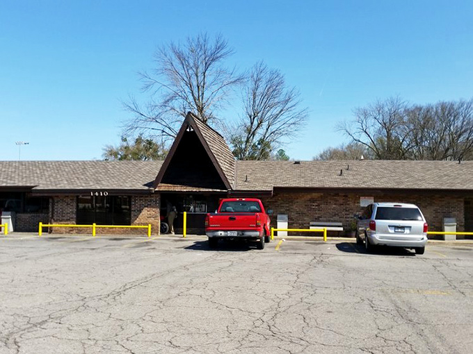 The unassuming A-frame entrance of Feltner's Whatta-Burger stands like a burger beacon in Russellville, promising no-frills deliciousness inside.