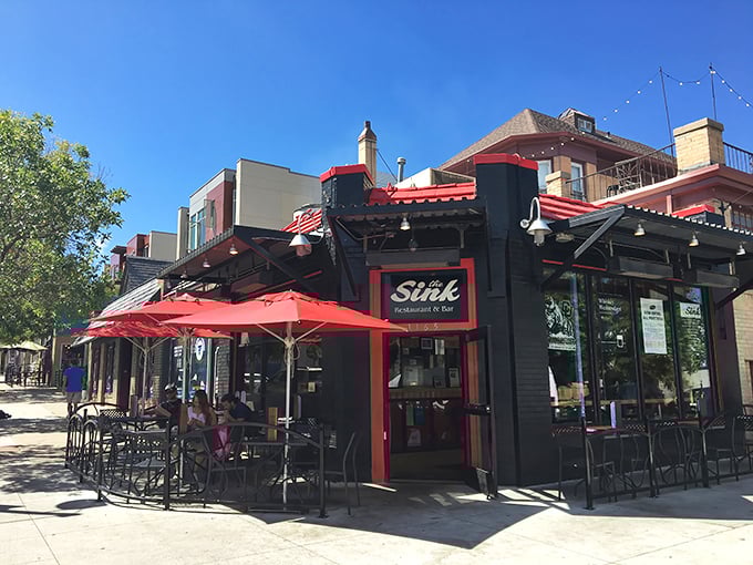 The Sink's iconic black exterior with red trim welcomes hungry pilgrims to this Boulder institution. Those red umbrellas promise shade for your burger-induced euphoria.