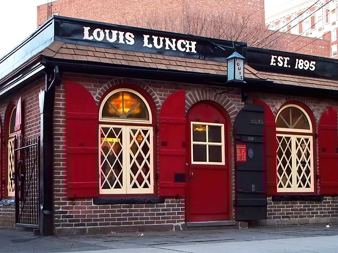 The little red brick building that changed America's culinary landscape forever. Louis' Lunch stands proudly in New Haven, a burger shrine disguised as a modest diner.