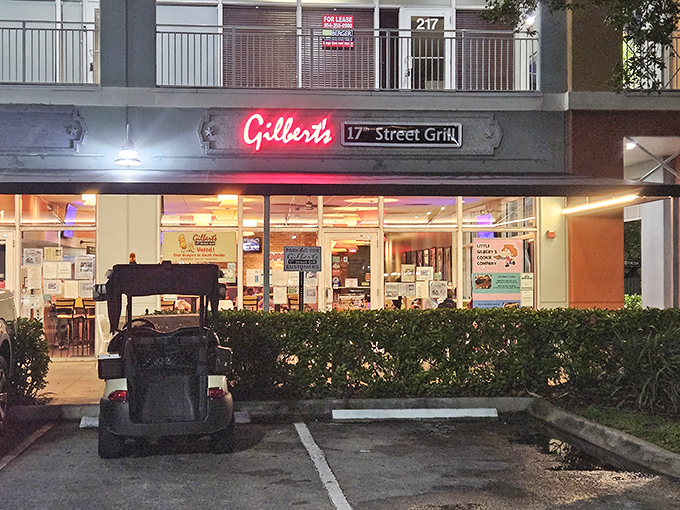 That red neon sign isn't just illuminating the night&mdash;it's a beacon calling to burger lovers everywhere. Simple storefront, extraordinary flavors waiting inside.