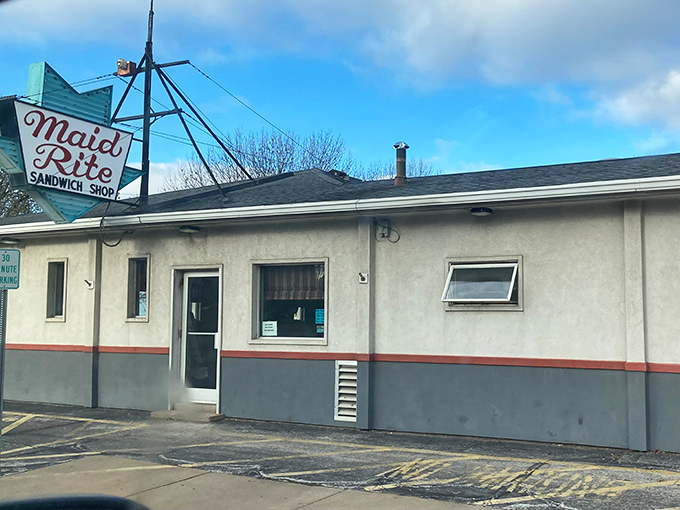 The iconic Maid-Rite sign beckons hungry travelers like a midwestern lighthouse, promising comfort food that's stood the test of time.
