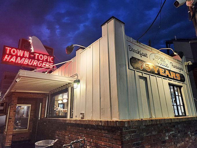 That neon glow isn't just a sign&mdash;it's a beacon of burger hope illuminating the Kansas City night, promising delicious salvation for hungry souls.