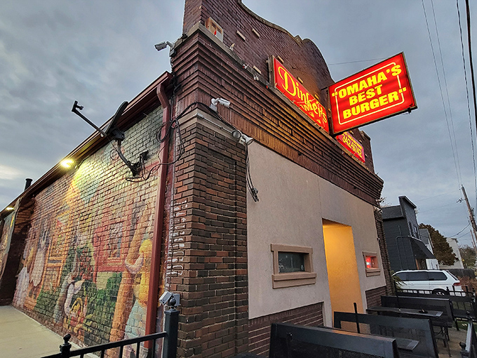 The neon doesn't lie! Dinker's iconic sign promises Omaha's best burger, and that brick exterior has witnessed decades of satisfied customers.