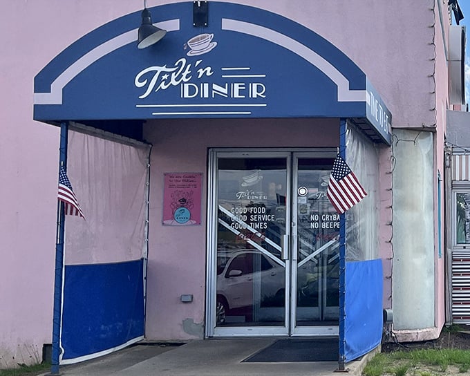 The blue-trimmed entrance of Tilt'n Diner promises exactly what we need: good food, good service, and good times—the holy trinity of diner perfection.
