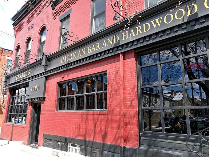The brick-red facade of Tessaro's stands like a beacon of burger hope on Liberty Avenue, promising carnivorous delights within those historic walls.