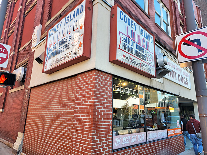 The iconic red and white sign beckons hungry travelers like a culinary lighthouse. "Famous Coney Island HOT DOGS" isn't just advertising&mdash;it's a promise kept for generations.