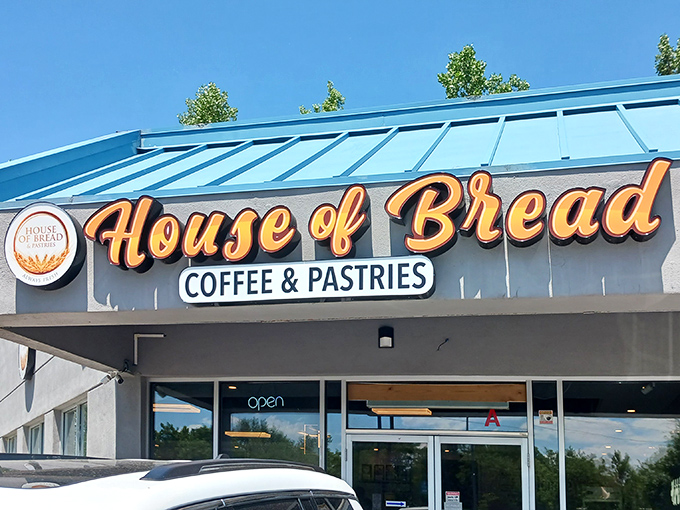 The blue-roofed sanctuary of carbs announces itself with golden lettering that practically whispers, "Yes, this is where the good stuff lives."