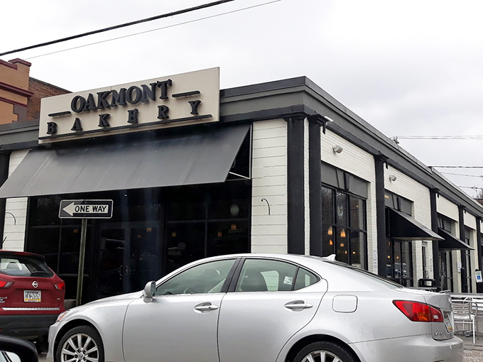 The iconic Oakmont Bakery sign stands like a beacon of hope for the sugar-deprived. This modern temple of temptation promises sweet salvation inside.