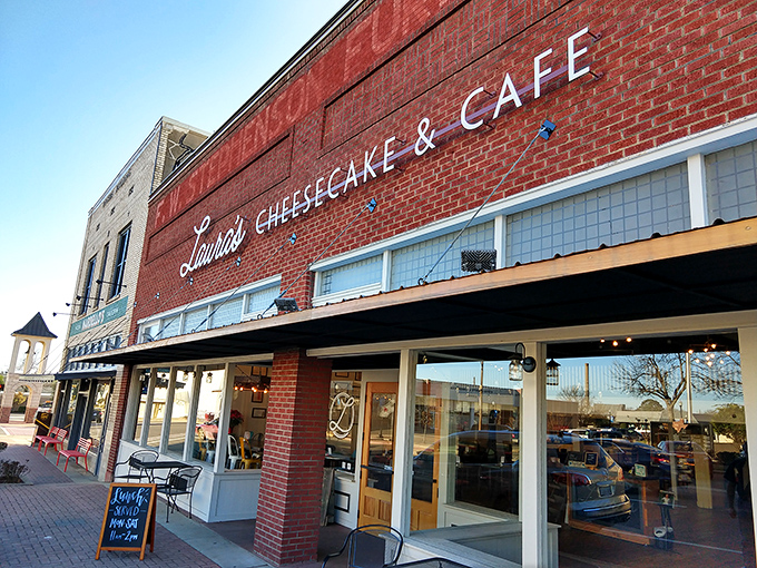 The iconic red brick fa&ccedil;ade of Laura's Cheesecake & Caf&eacute; stands as a beacon of culinary comfort on Mount Pleasant's town square, promising sweet salvation within.