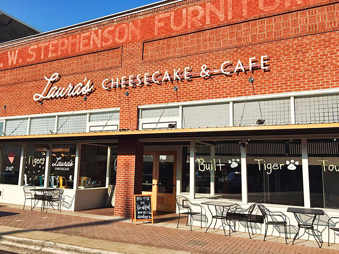 The iconic red brick fa&ccedil;ade of Laura's Cheesecake & Caf&eacute; stands as a beacon of culinary comfort on Mount Pleasant's town square, promising sweet salvation within.