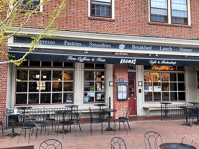 The classic brick façade of Aromas welcomes visitors with the promise of caffeine and comfort, a beacon of culinary delight in historic Williamsburg.