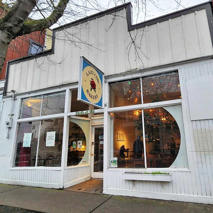 The unassuming white exterior of Lazy Cow Bakery proves once again that Seattle's best culinary treasures often hide in plain sight, no neon required.