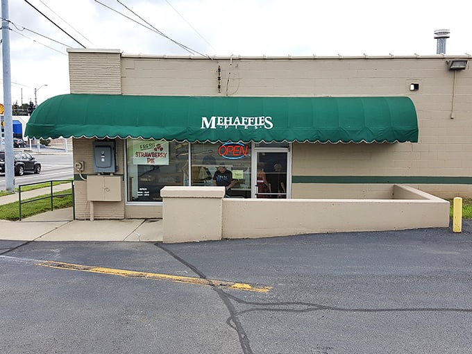 The unassuming exterior of Mehaffies Pies proves once again that the best desserts often hide behind the simplest facades. That green awning is basically a superhero cape for pastry.