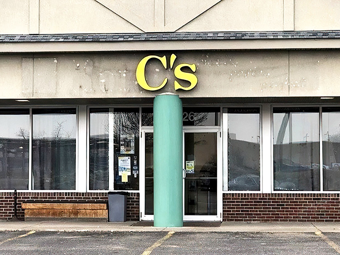 The bright yellow C's Waffles sign stands out like a breakfast beacon, promising morning salvation to hungry Ohioans with its distinctive teal column.