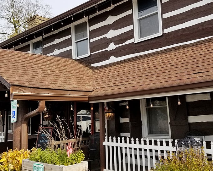The Log Cabin Inn's exterior is exactly what Kentucky comfort food deserves—authentic log construction that promises zero pretension and maximum flavor.