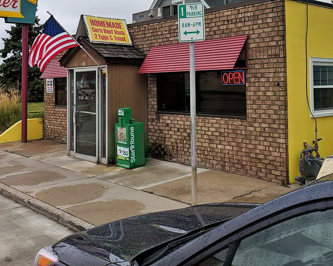 A humble brick fortress with an American flag standing guard, protecting the culinary treasures that await inside.