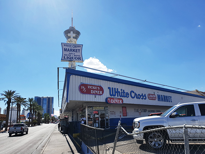 Vickie's Diner stands proudly alongside White Cross Market, a blast from Vegas past where neon promises and comfort food dreams come true 24 hours a day.