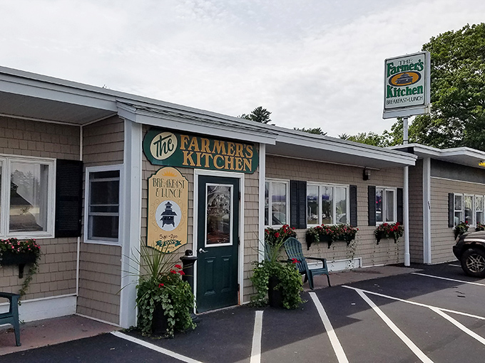 The unassuming exterior of Farmer's Kitchen belies the culinary treasures within. Those colorful flower boxes are your first clue that someone here cares about the details.