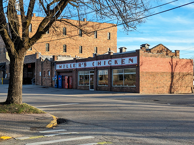 The iconic brick façade of Miller's Chicken stands as Athens' monument to comfort food, complete with seasonal poinsettias that say "we care about the details."