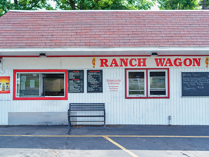 The unassuming white exterior with bold red lettering promises no frills, just thrills for your taste buds. Roadside perfection awaits.