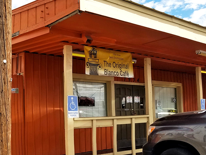 The unassuming orange exterior of Blanco Cafe stands like a humble guardian of culinary treasures. No fancy frills, just the promise of authentic Tex-Mex magic inside.