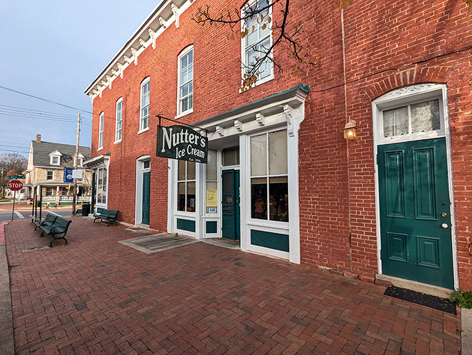 The historic red brick fa&ccedil;ade of Nutter's Ice Cream stands like a sweet sentinel in downtown Sharpsburg, promising cold comfort since 1996.