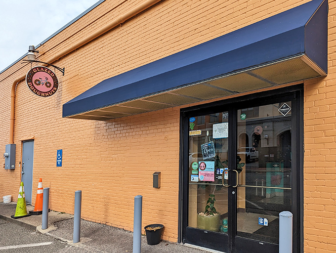 The unassuming exterior of Glazed Doughnuts in Hampton hides a world of pastry perfection. Sometimes the best treasures come in plain white packages.