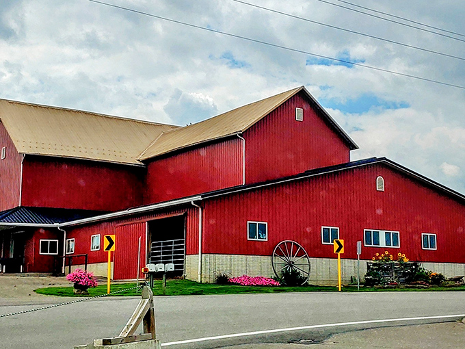 The iconic red barn of Hershberger's stands like a beacon of deliciousness against the Ohio sky, promising homemade treats and farm-fresh goodness inside.