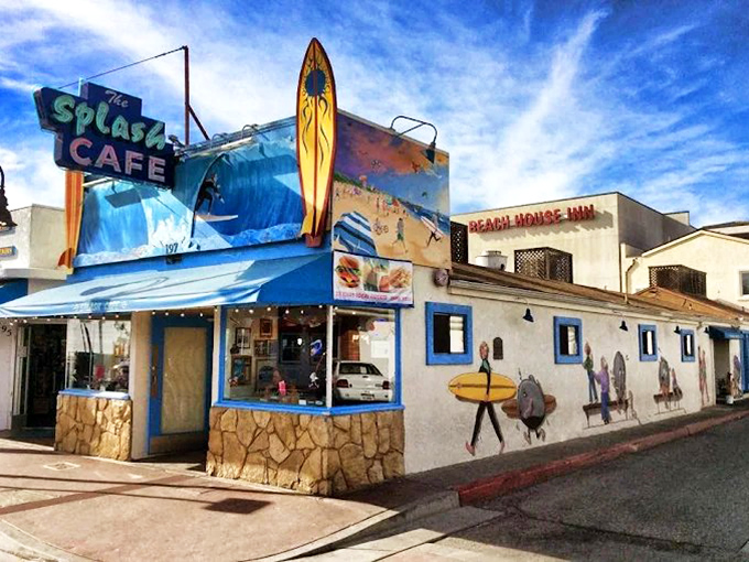 The iconic blue-and-white exterior of Splash Caf&eacute; stands like a beacon for chowder pilgrims, complete with that charming surfboard signaling delicious waves ahead.