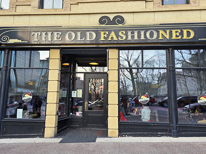 The Old Fashioned stands proudly on Madison's Capitol Square, its classic signage promising Wisconsin comfort in a building that looks like it's been telling stories for generations.