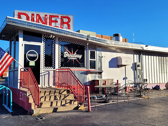 That iconic red DINER sign against the blue Missouri sky is like a beacon of breakfast hope for hungry souls. The American flag adds that perfect touch of hometown pride.