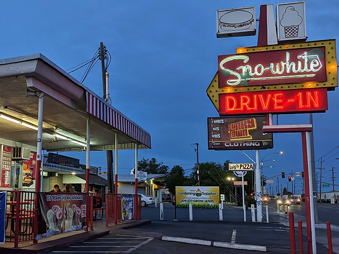 That neon sign isn't just illuminating a parking lot&mdash;it's a beacon calling to burger lovers across Modesto's twilight sky.
