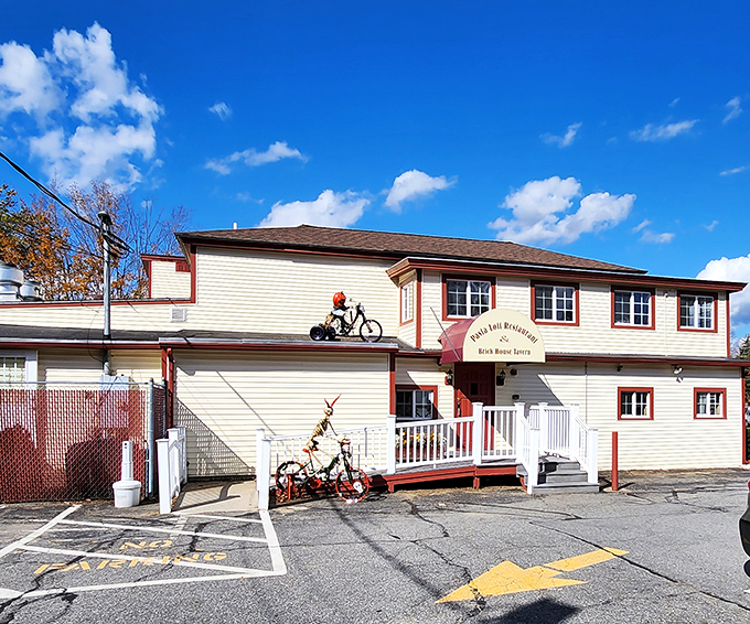 The unassuming exterior of Pasta Loft belies the culinary treasures within. That bicycle on the roof? It's how the staff burns off all those carbs.