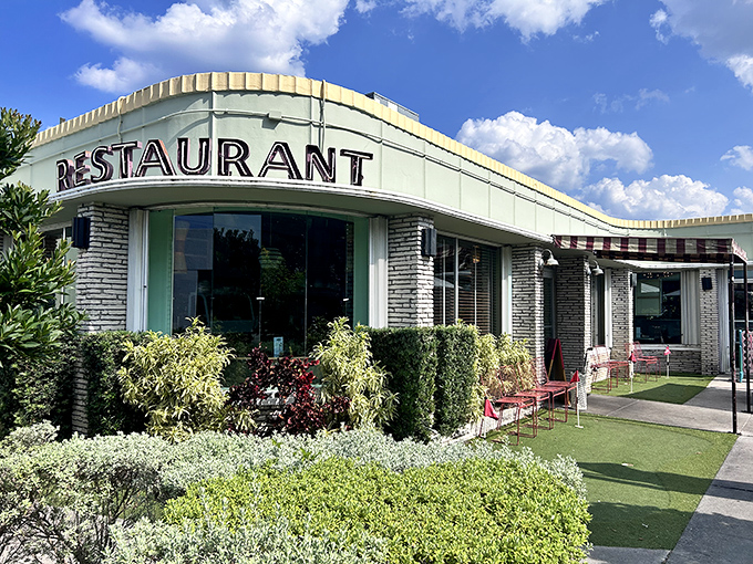 Mint-green dreams and retro vibes! Howley's exterior beckons with mid-century charm that promises comfort food magic within those welcoming walls.