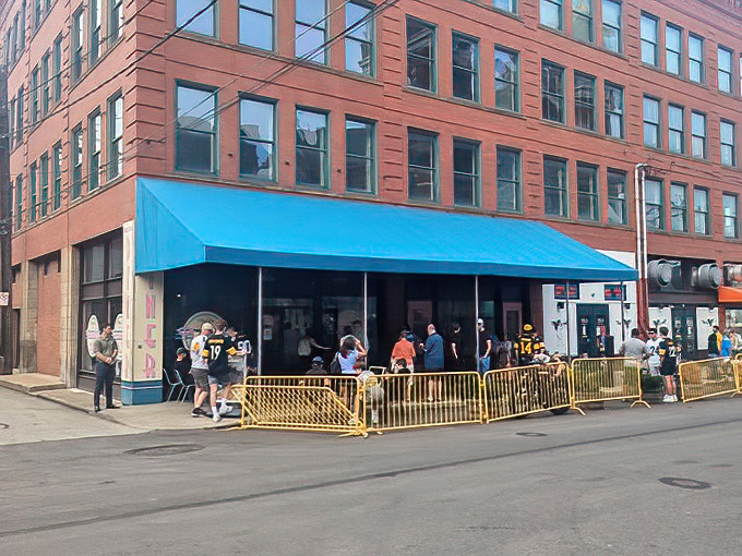 The iconic blue awning of Pamela's Strip District location beckons hungry Pittsburghers like a breakfast lighthouse in a sea of morning hunger.