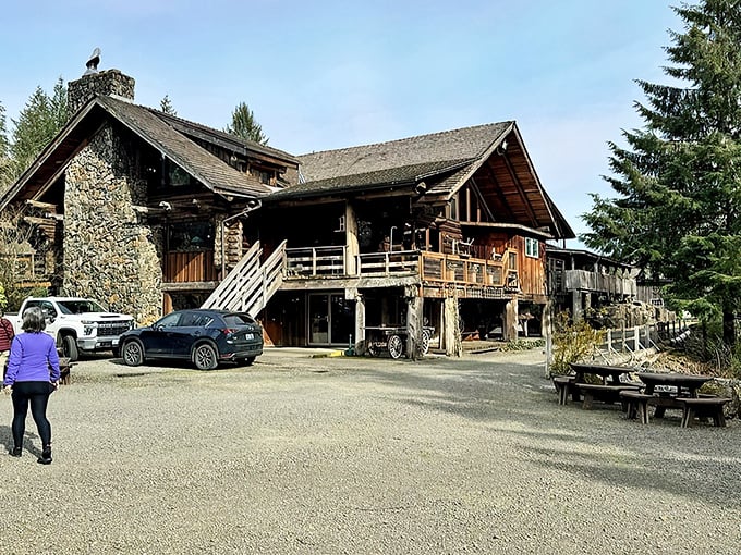 The rugged stone and timber exterior of Camp 18 stands like a mountain lodge mirage on Highway 26, beckoning hungry travelers with its impressive craftsmanship.