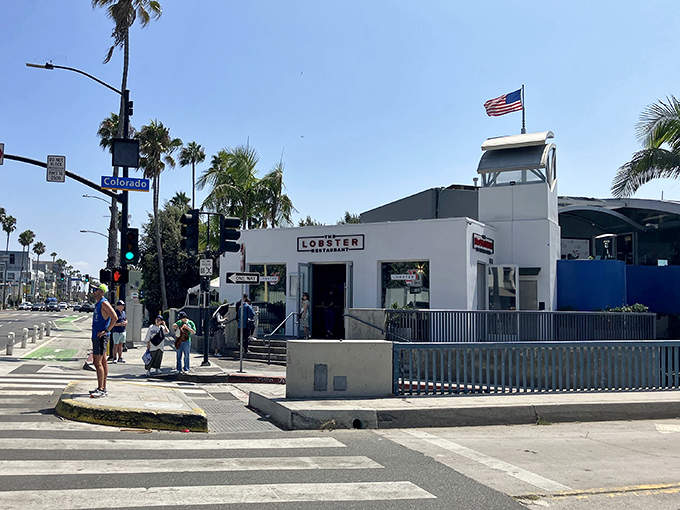 The pristine white exterior of The Lobster beckons seafood lovers at the entrance to Santa Monica Pier, promising oceanic delights with unbeatable views.
