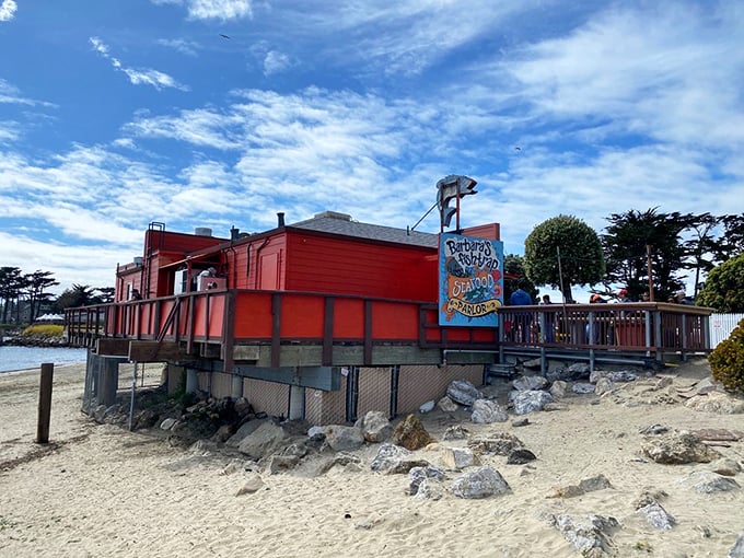 The bright orange beacon of Barbara's Fishtrap stands proudly against the California blue sky, promising seafood treasures to those who make the coastal pilgrimage.