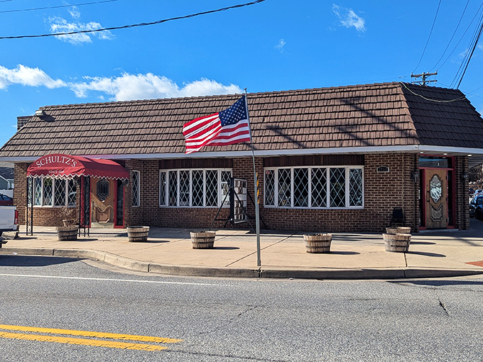 The iconic red awning of Schultz's welcomes seafood pilgrims like a lighthouse guiding hungry sailors home. A Maryland institution since 1969
