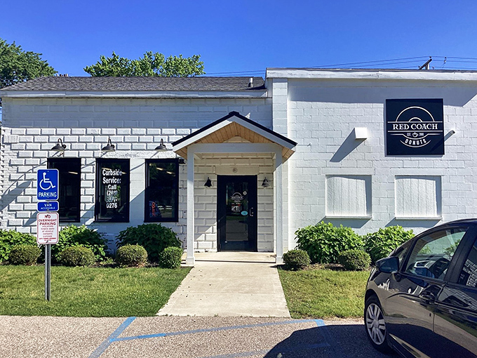 The unassuming white brick exterior of Red Coach Donuts in Stevensville hides a treasure trove of sugary delights waiting inside.