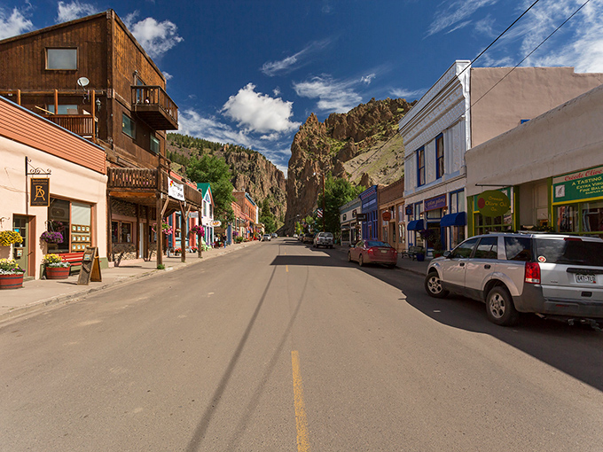 Downtown Creede stretches before you like a living postcard, where towering cliff walls play guardian to a main street that hasn't forgotten what year it was built.