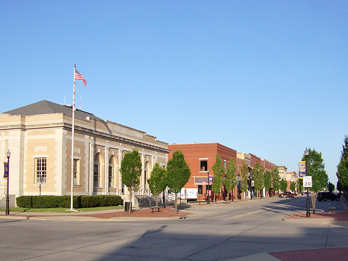 The iconic Parsons archway stands like a welcoming smile, inviting you into a town where your retirement dollars stretch further than your last diet plan.