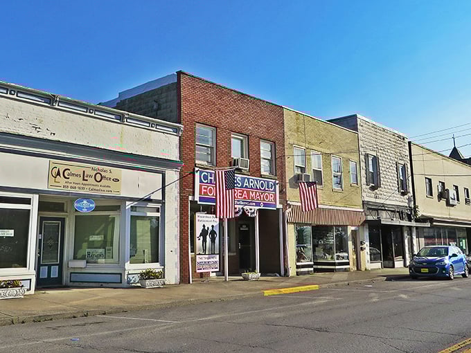 Berea's historic downtown storefronts stand like a living museum, where American flags flutter proudly above Arnold's Pawn Shop, preserving small-town charm in technicolor.