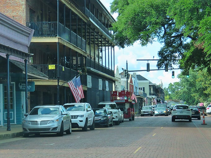 Brick streets and historic buildings&mdash;Natchitoches' Front Street feels like stepping into a time machine where modern cars look oddly out of place.