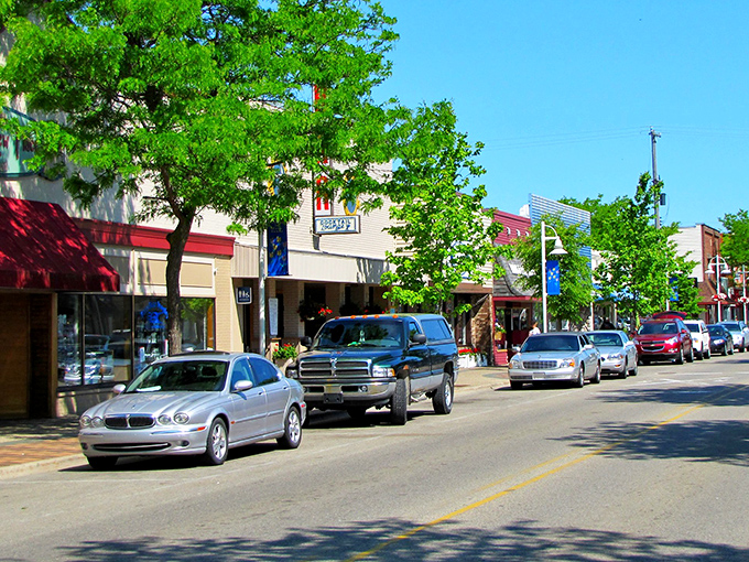 Newman Street welcomes visitors with its classic small-town charm. Leafy trees provide perfect shade for window shopping on summer afternoons.